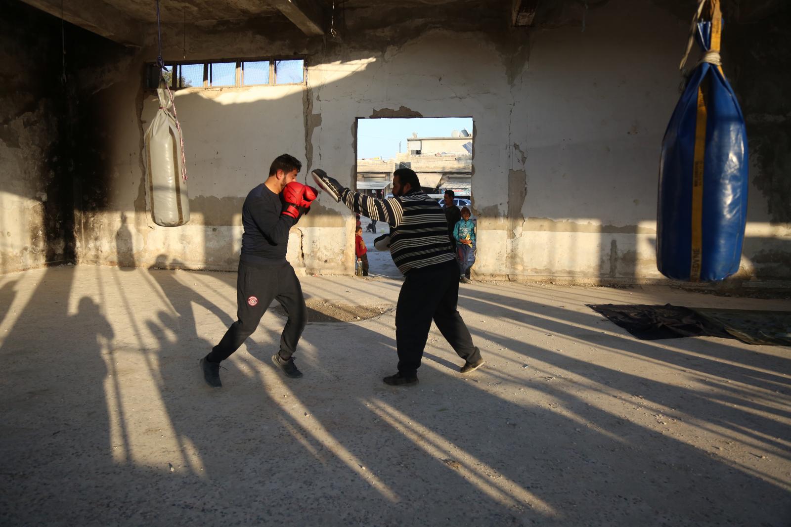 Boxing workout in the Syrian town of Atareb. by Ali Haj Suleiman