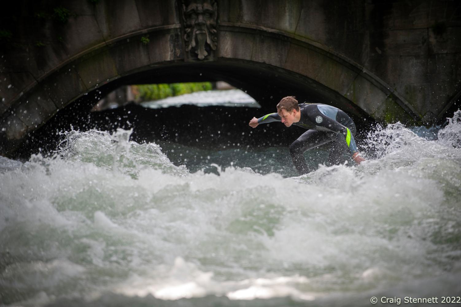 Surfing the Eisbachwelle, Munich, Bavaria, Germany by craig stennett